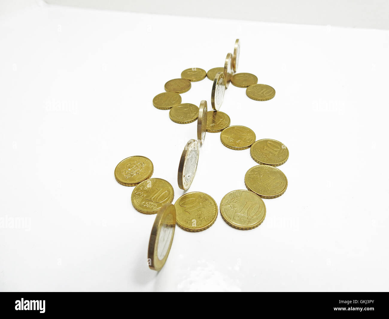 Dollar symbol build from coins on white background Stock Photo - Alamy