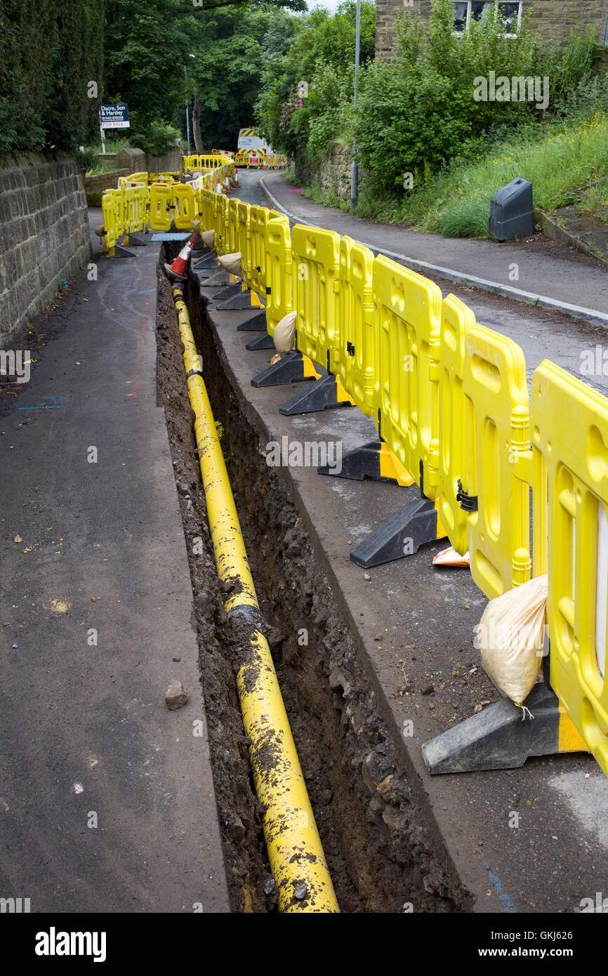 Gas pipes being replaced in road Stock Photo - Alamy