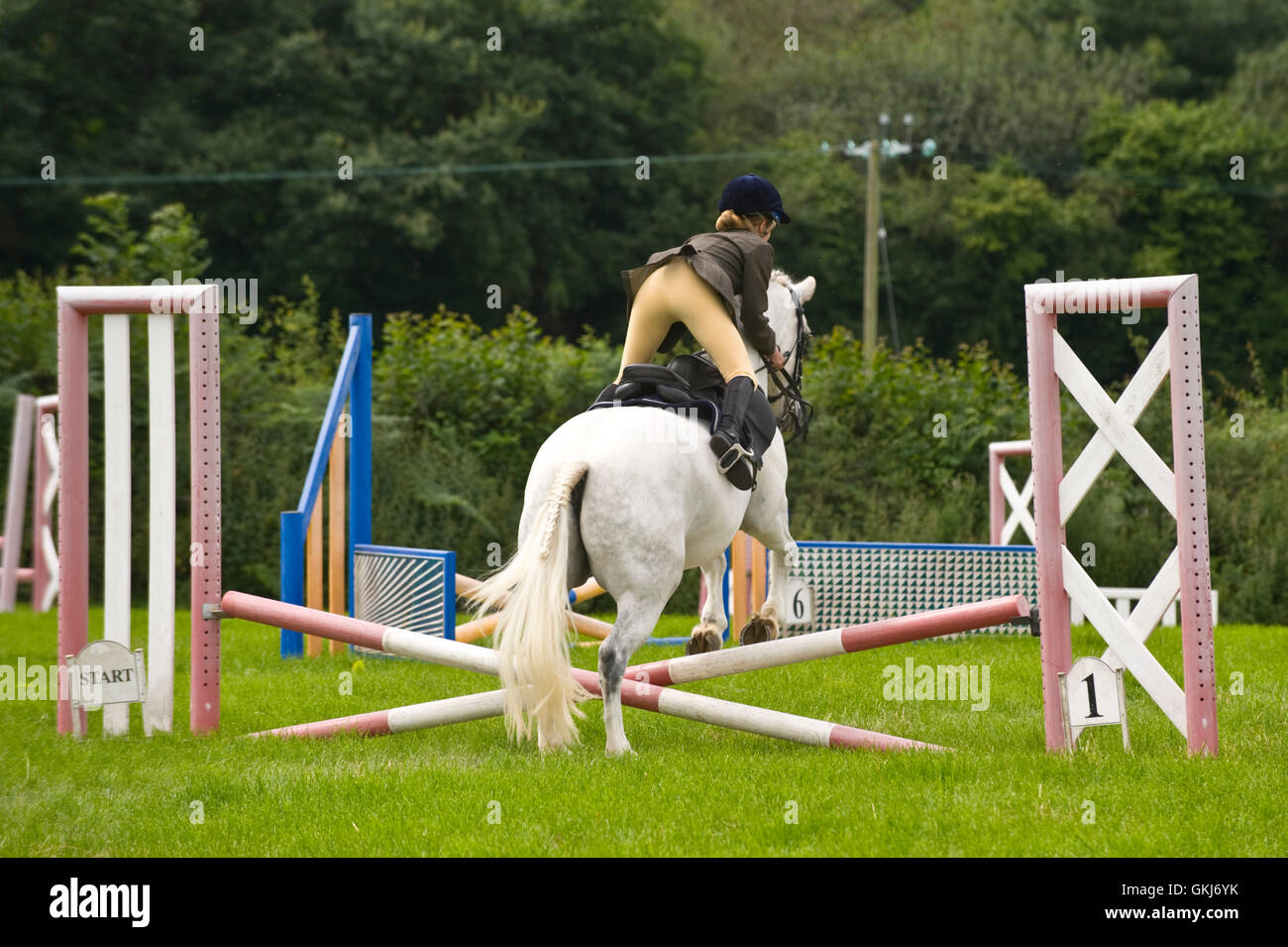 Teenage girl show jumping on her pony at Llanigon YFC Show 2016 nr Hay ...