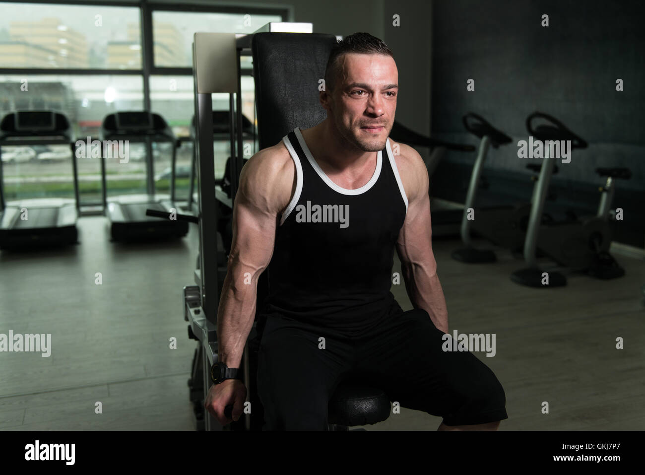 Young Physically Bodybuilder Working Out Triceps On Machine Stock Photo ...