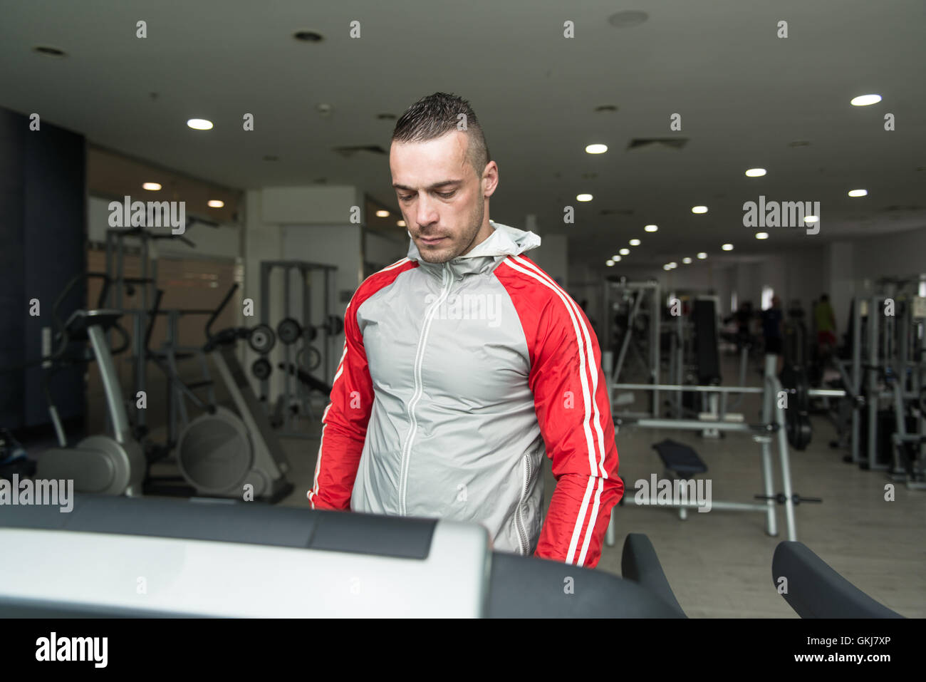 Handsome Man Running On The Treadmill In Gym Stock Photo - Alamy