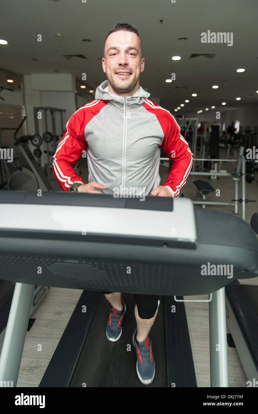 Handsome Man Running On The Treadmill In Gym Stock Photo - Alamy