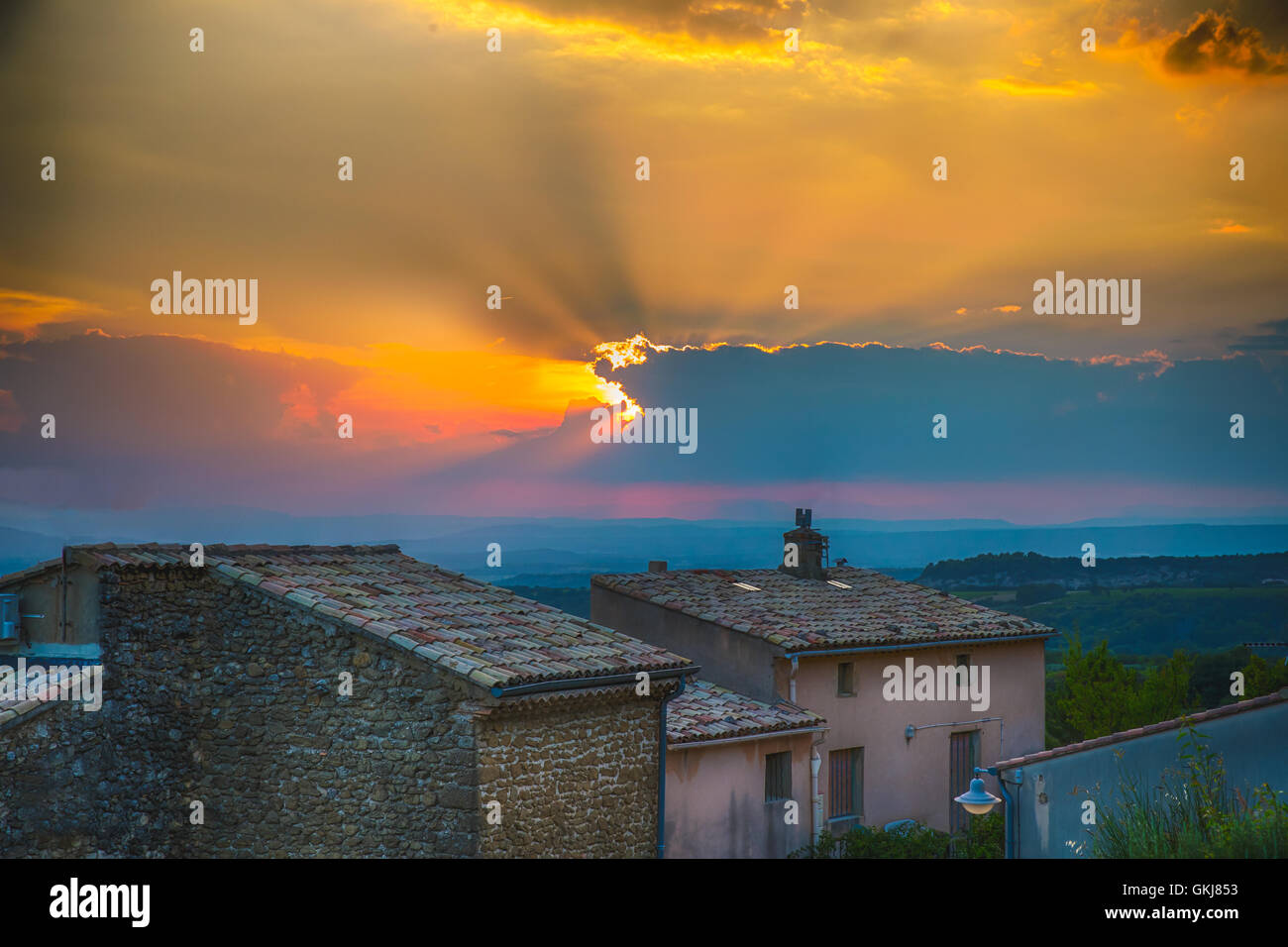 Sunset above French old village Stock Photo - Alamy