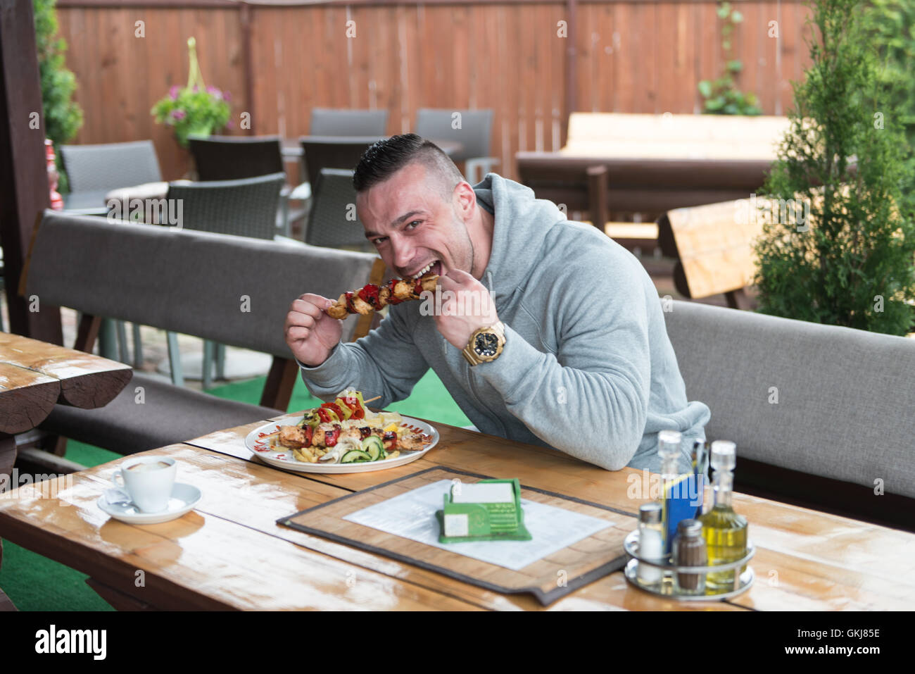 Person eating chicken gym hi-res stock photography and images - Alamy