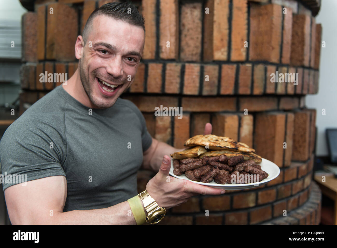 Young Man Is Very Hungry - He Is Ready To Eat Cevapi In Bread Stock ...