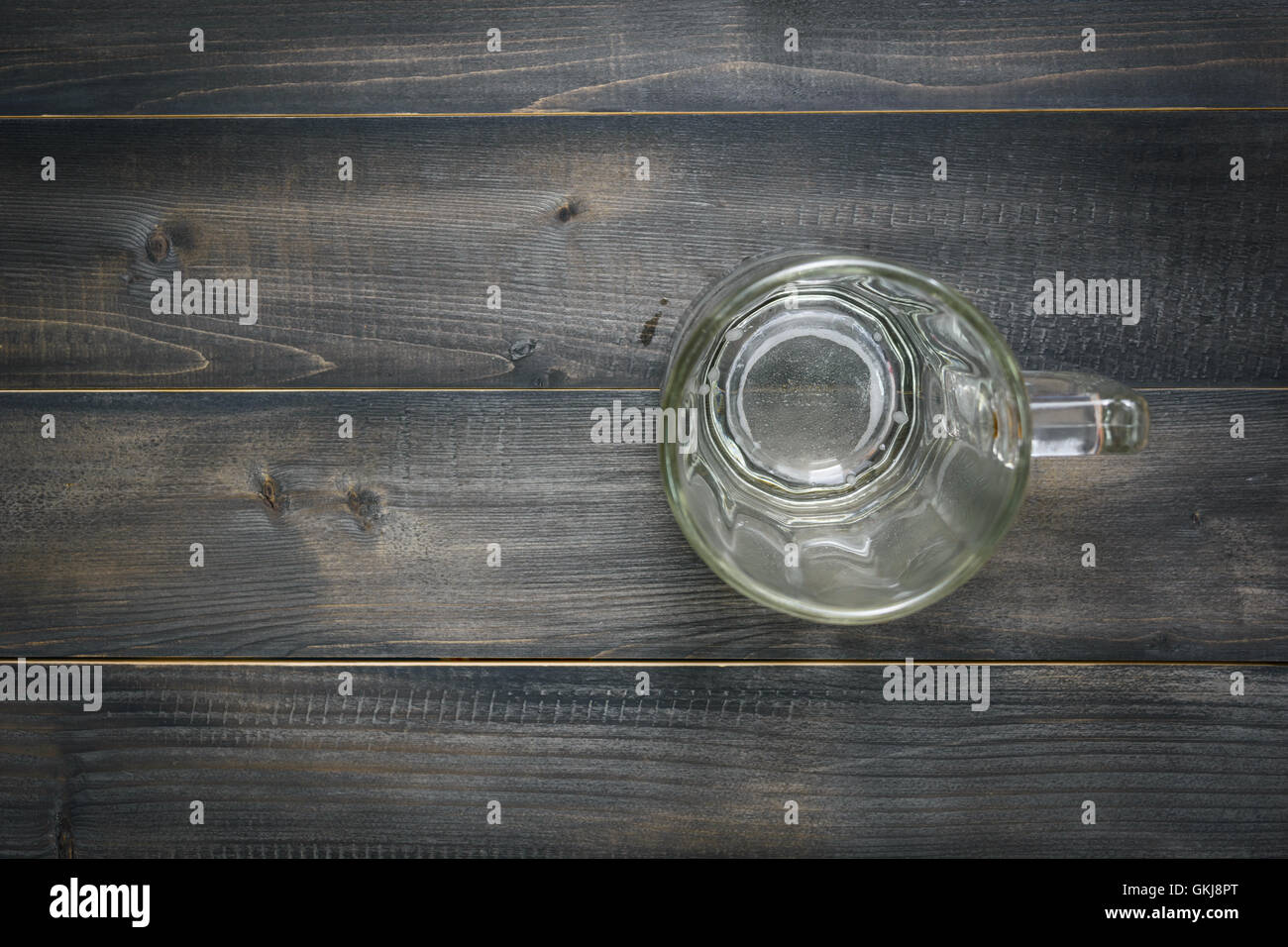 empty glass on wooden background top view Stock Photo - Alamy