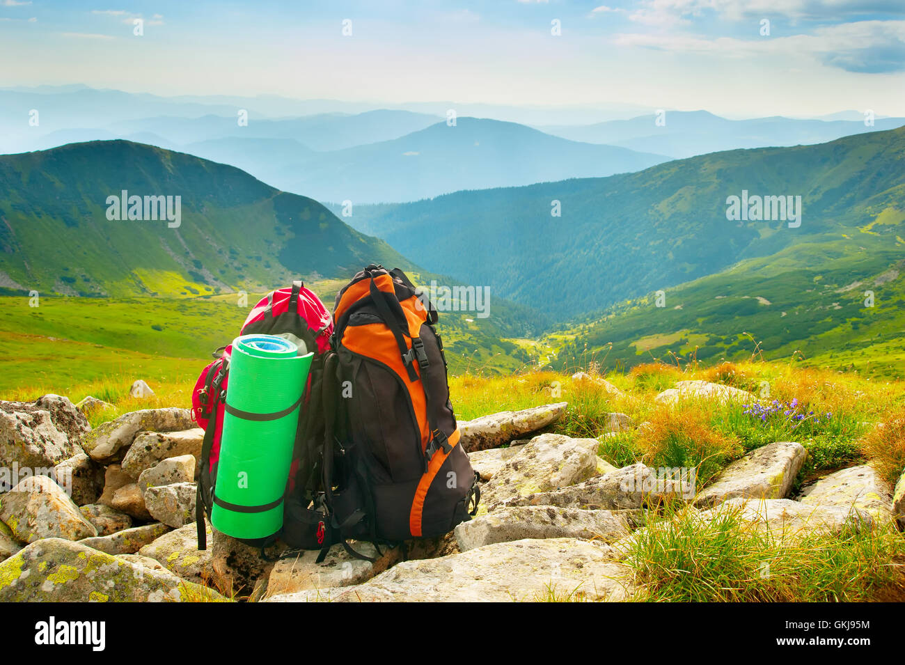 Two Tourist Bags In Front Of High Mountains Stock Photo - Alamy