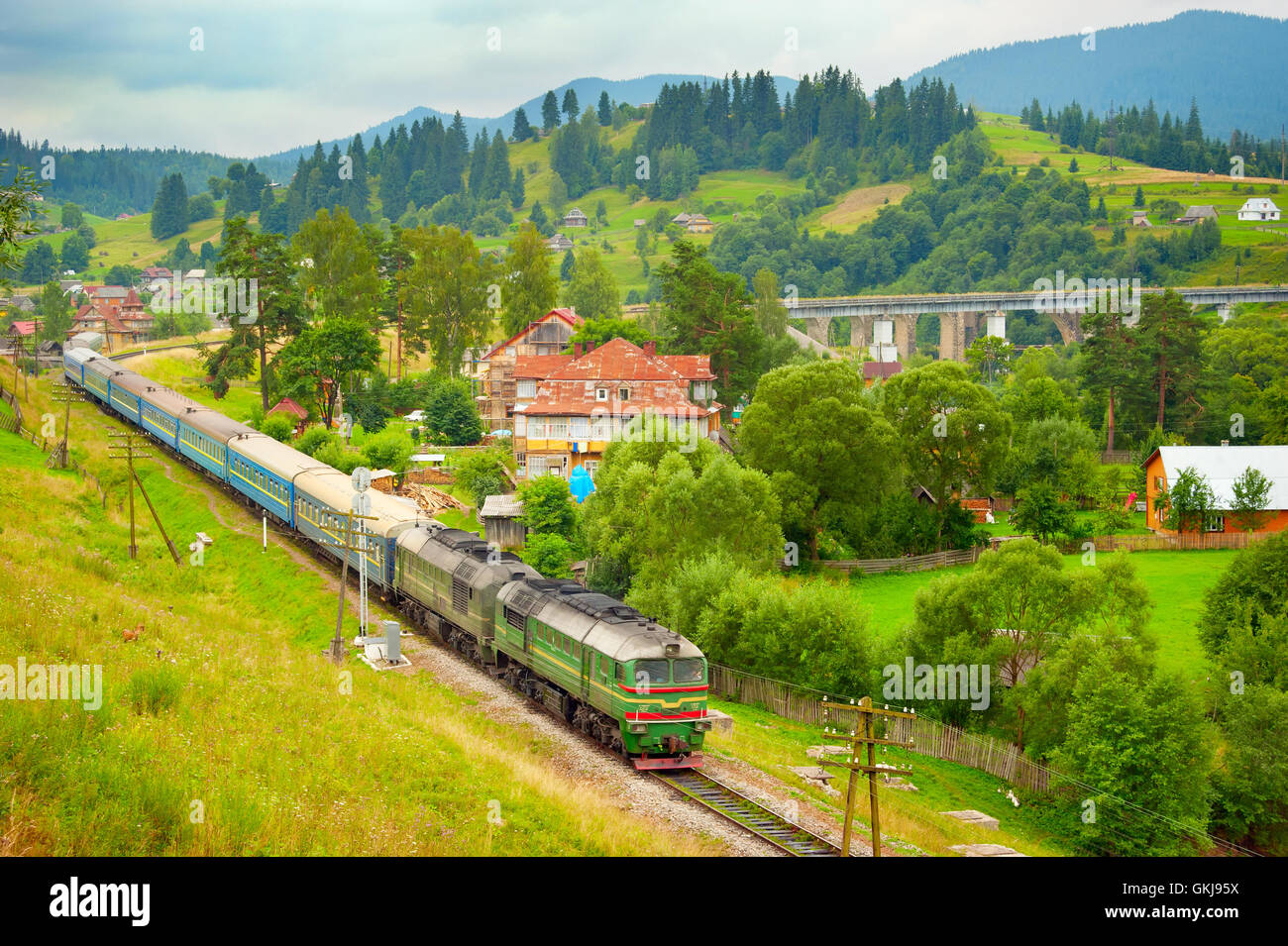 Passenger train in the Carpathians Mountains village. Ukraine Stock ...