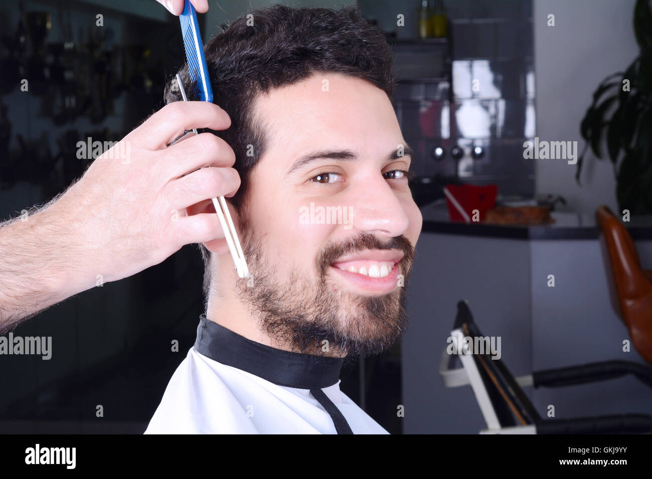 Close up of young man having a haircut with straight razor Stock Photo ...
