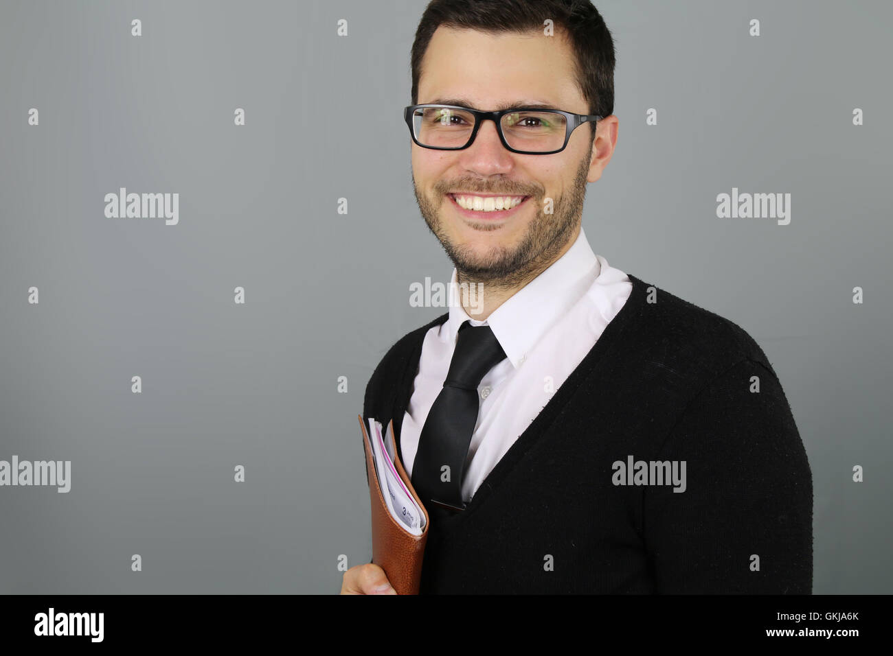 Young student smiling Stock Photo - Alamy