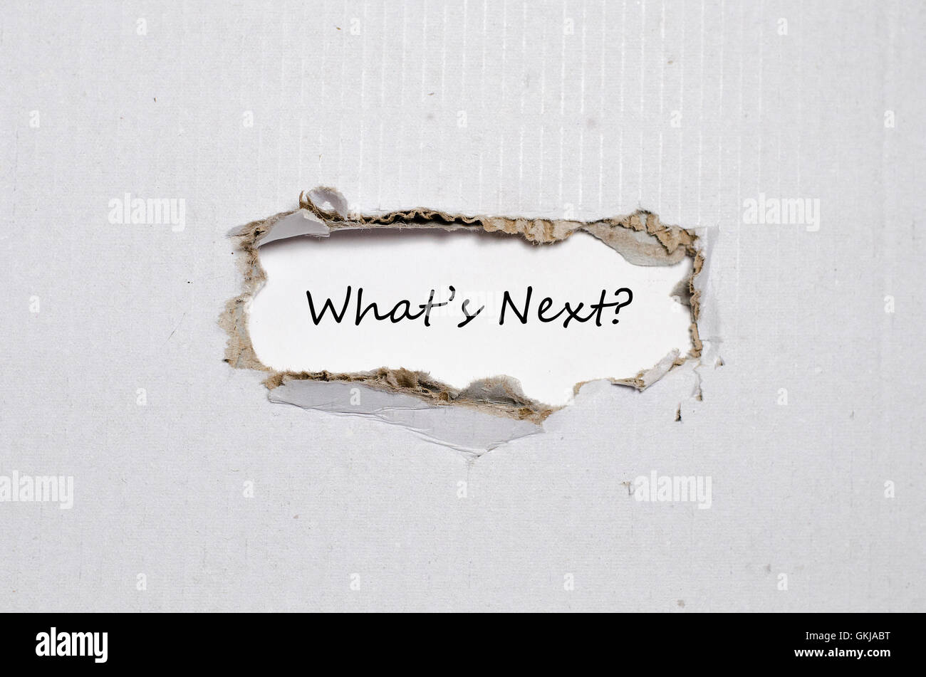The words what's next appearing behind torn paper Stock Photo - Alamy