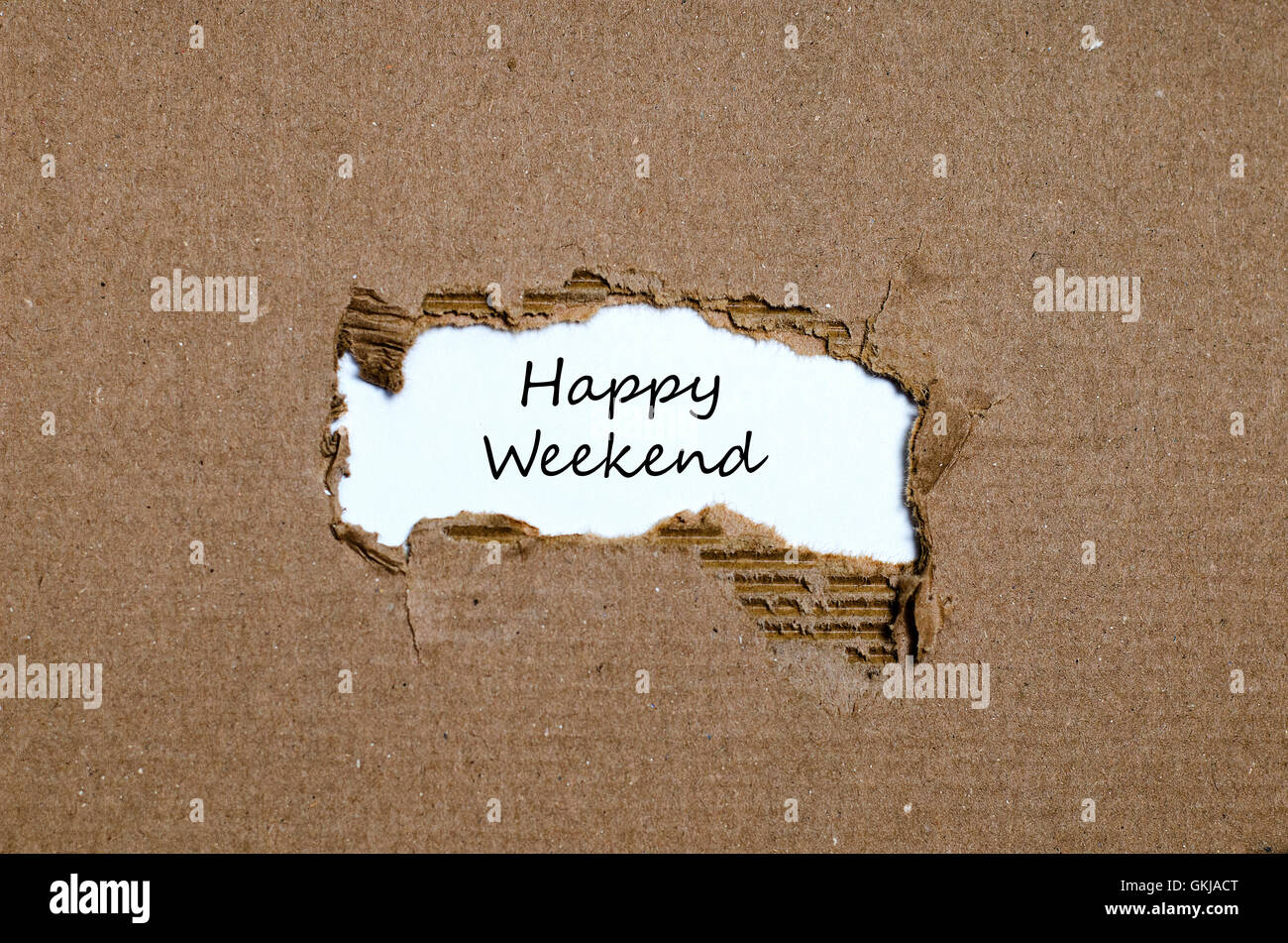 The words happy weekend appearing behind torn paper Stock Photo - Alamy