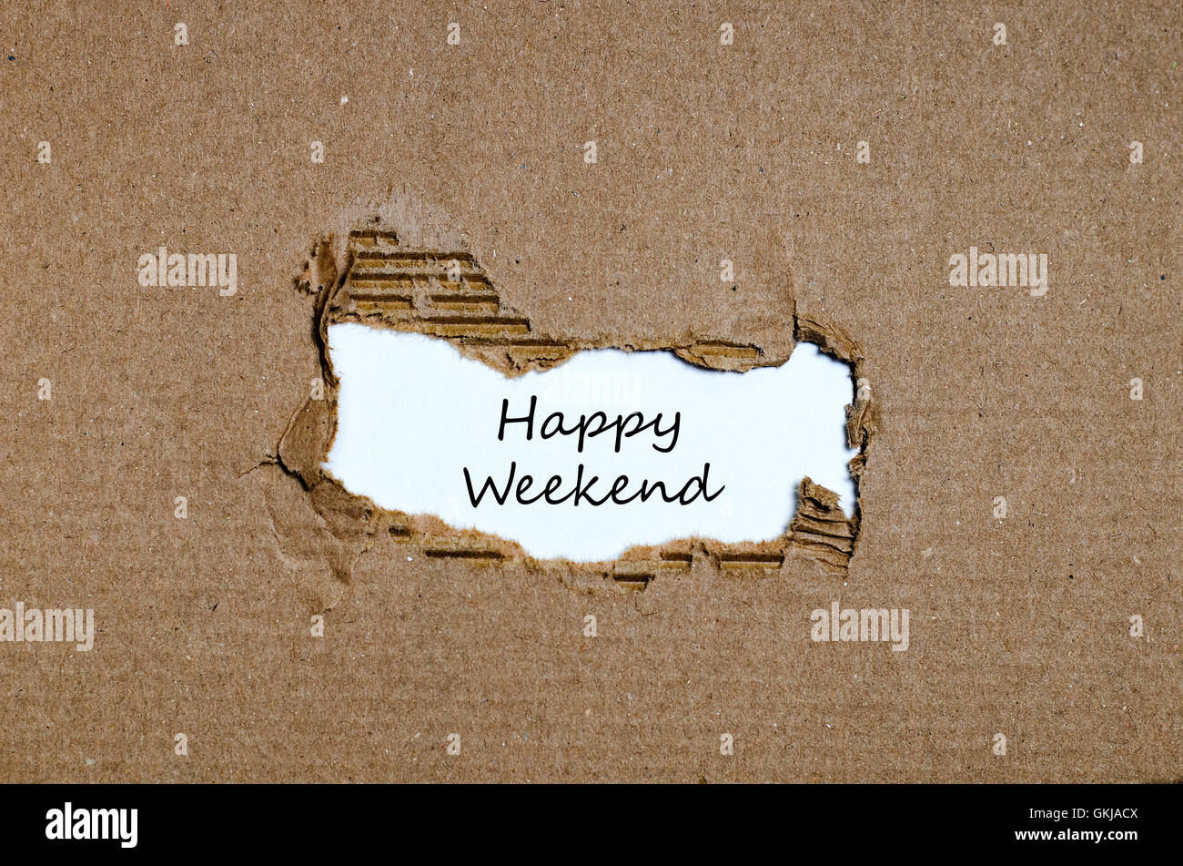The words happy weekend appearing behind torn paper Stock Photo - Alamy