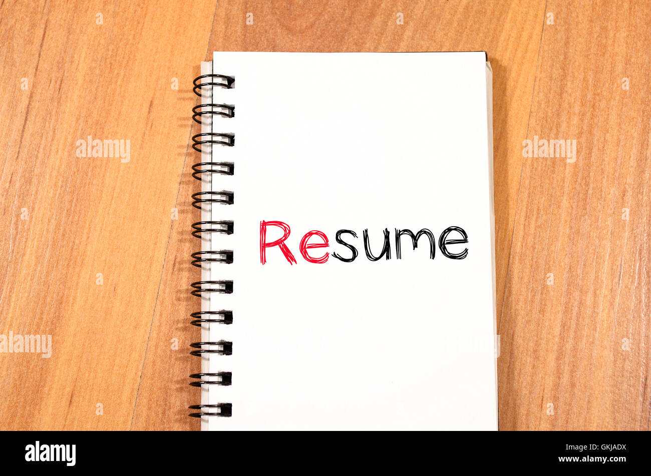 Resume news text concept write on notebook Stock Photo - Alamy