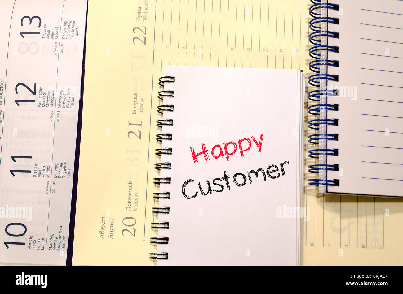 Happy customer text concept write on notebook Stock Photo - Alamy