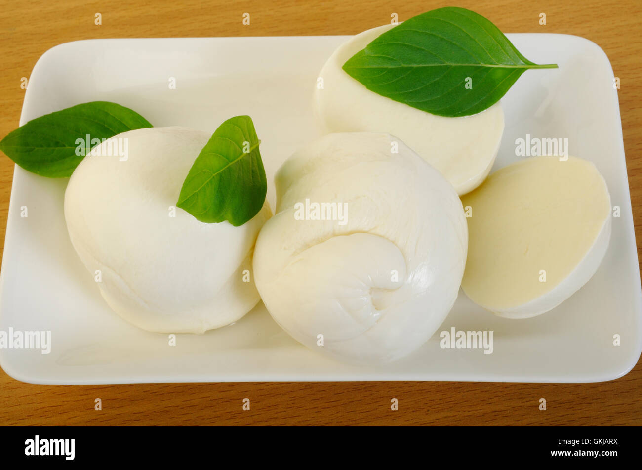 fresh mozzarella cheese with basil Stock Photo - Alamy