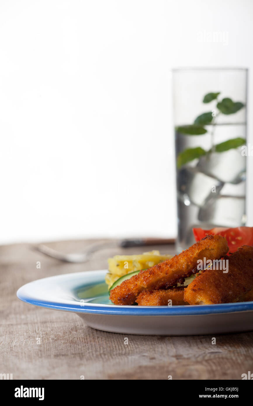 fish fingers and potato salad Stock Photo - Alamy