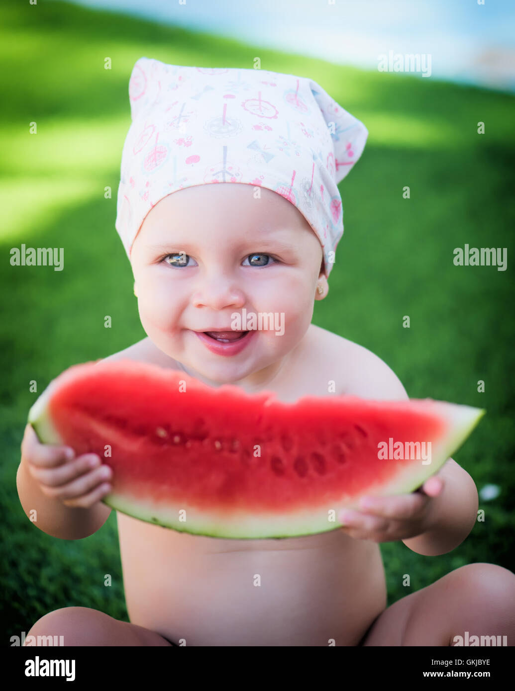 Baby eating melon hi-res stock photography and images - Alamy