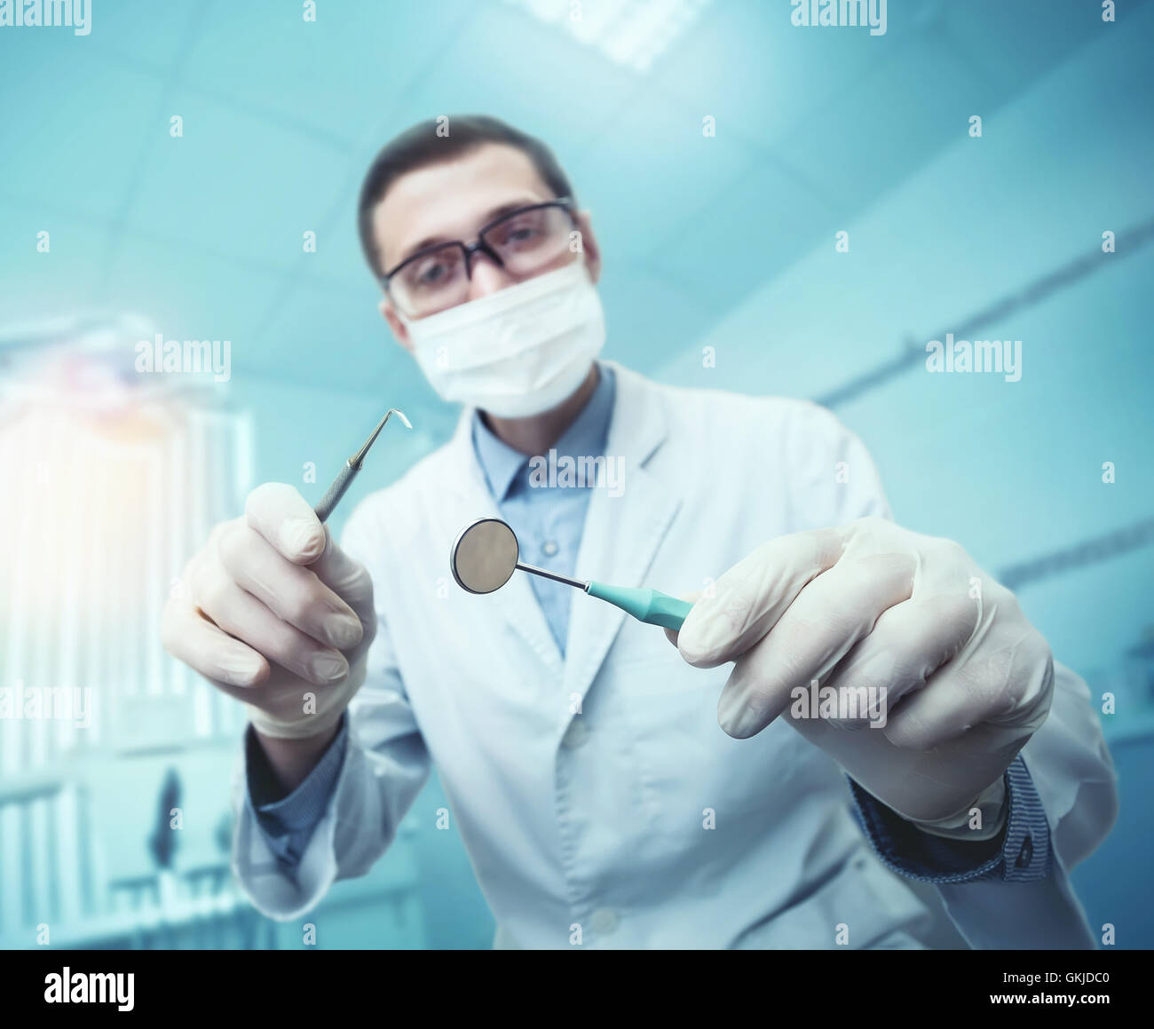 Dentist while working Stock Photo - Alamy