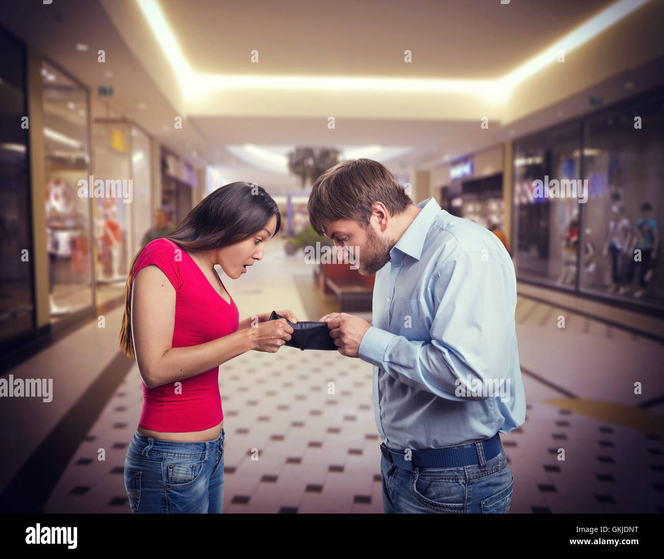 Couple looking for money Stock Photo - Alamy