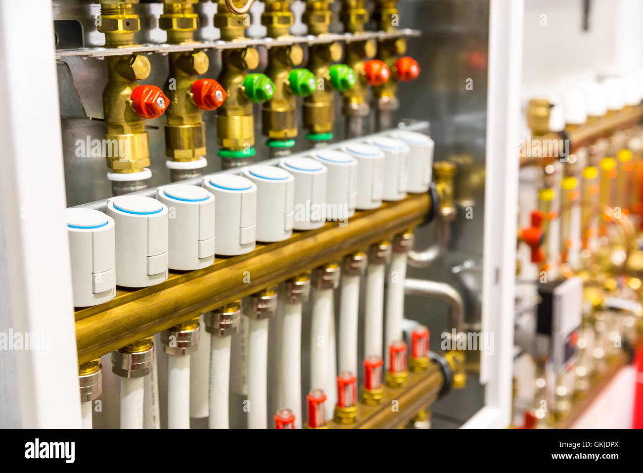 Heating floor system collector Stock Photo - Alamy