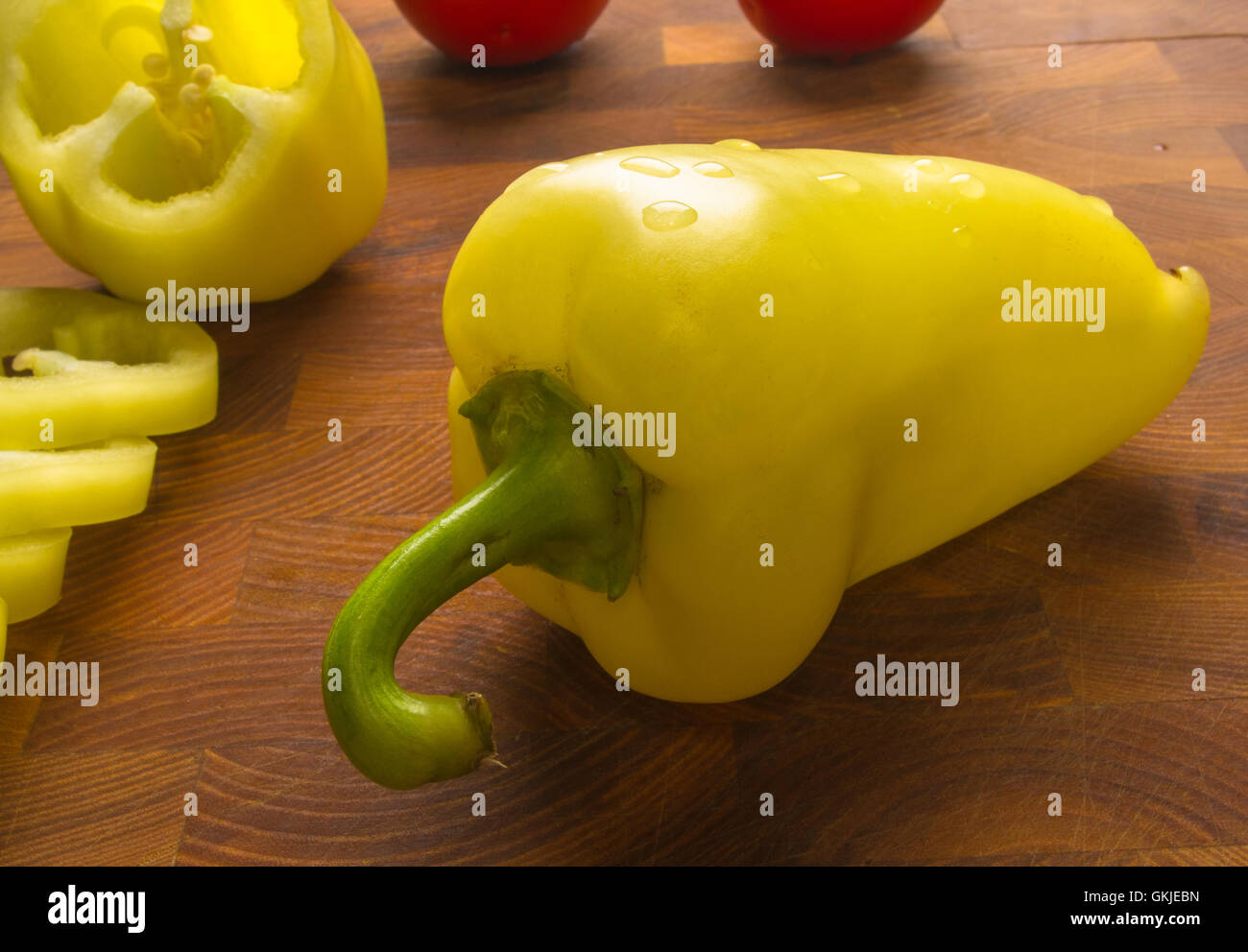 still life - yellow pepper on wooden Board Stock Photo - Alamy