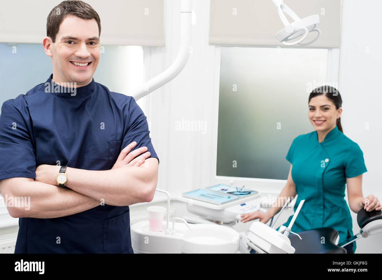 Female physician folded arms hi-res stock photography and images - Alamy