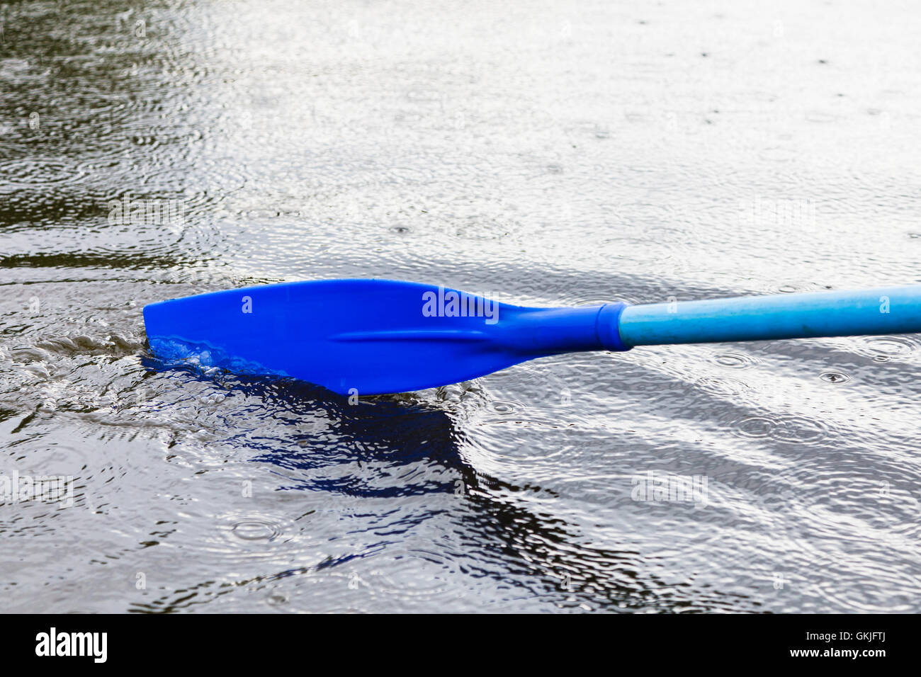 paddle blade in water during boating on the pond in rain Stock Photo ...
