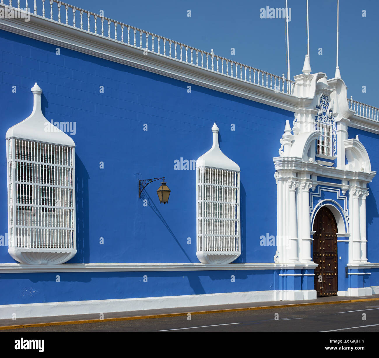 Bright blue and white Spanish colonial style building in the Plaza de ...