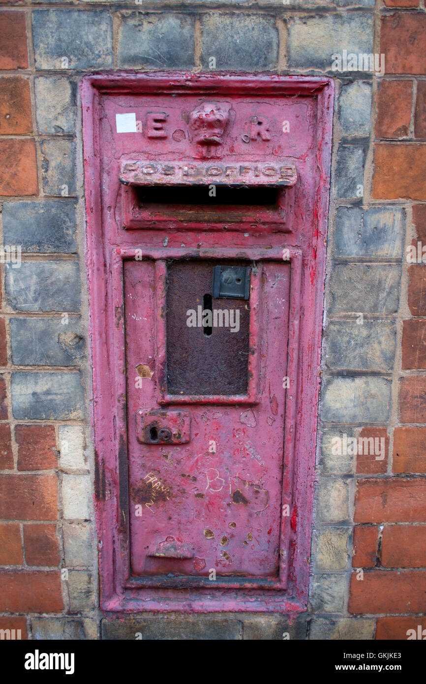 Old English Red Letterbox in wall Stock Photo - Alamy