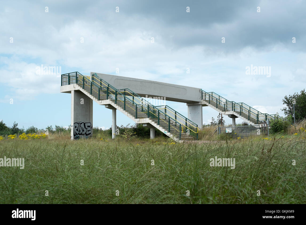 Walkway over train track in field Stock Photo - Alamy