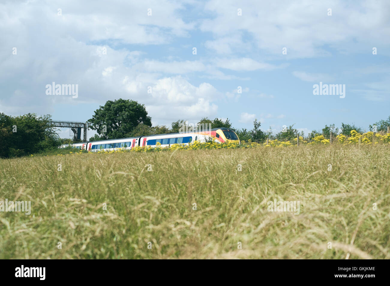 Fast inter city train through countryside Stock Photo - Alamy