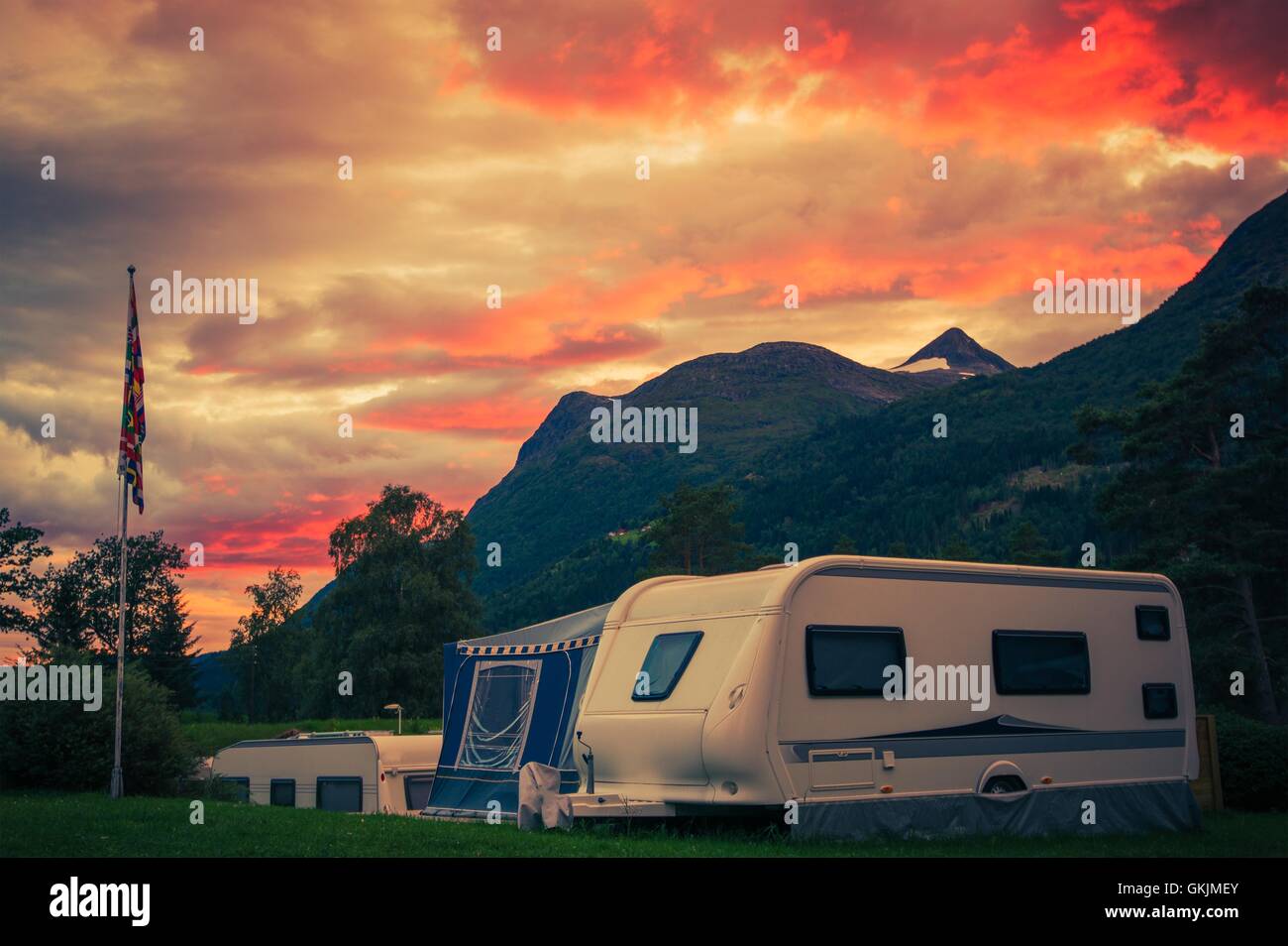 Scenic Camping Sunset. Sunset Sky Over Campground with Travel Trailers ...