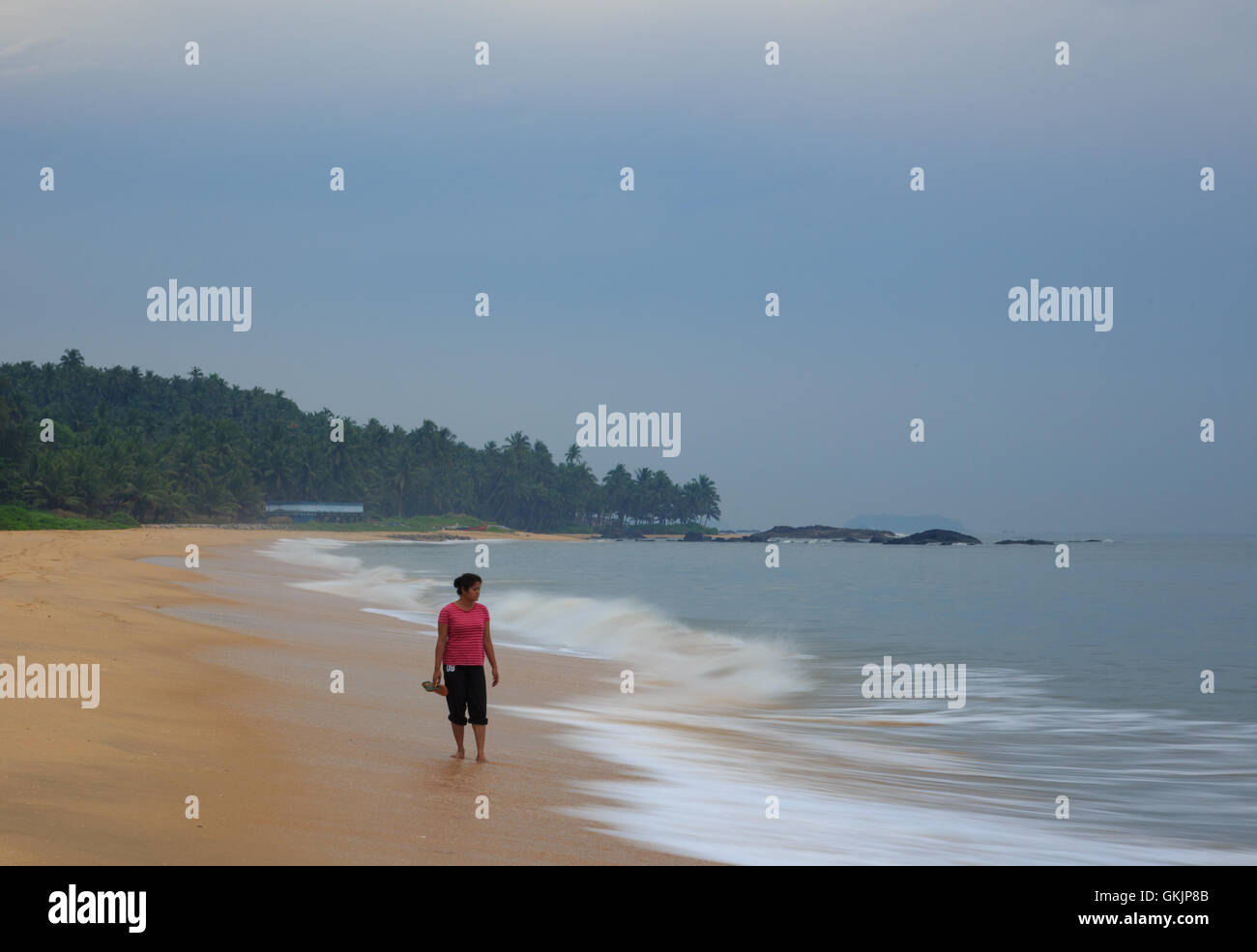 Lady walking by the beach hi-res stock photography and images - Alamy