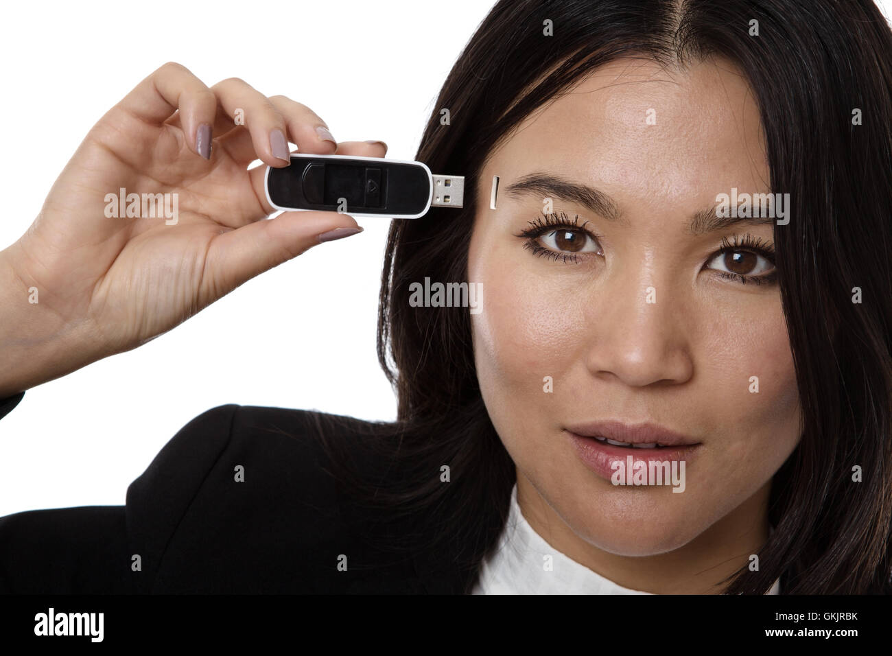 business woman plugging a usb hard drive into her brain Stock Photo - Alamy
