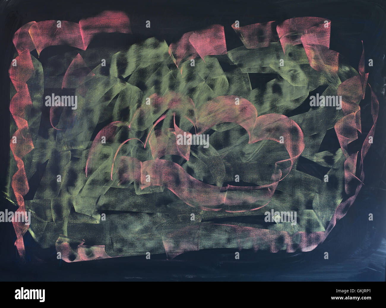 Black chalkboard with random chalk drawing in pink and light green ...