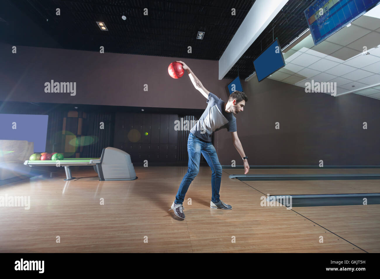 Man playing bowling Stock Photo - Alamy
