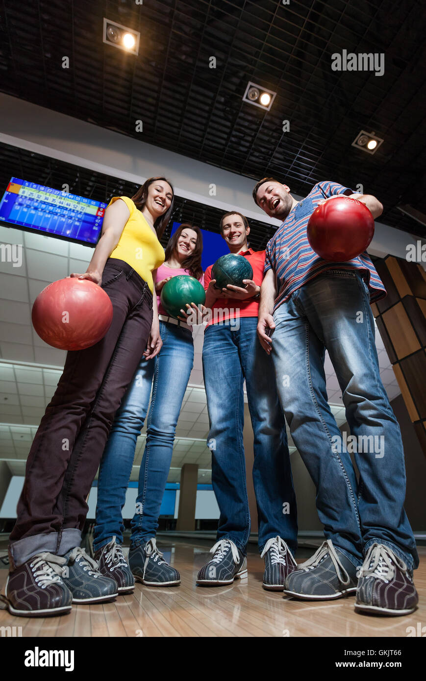 Woman at bowling alley holding bowling ball hi-res stock photography ...