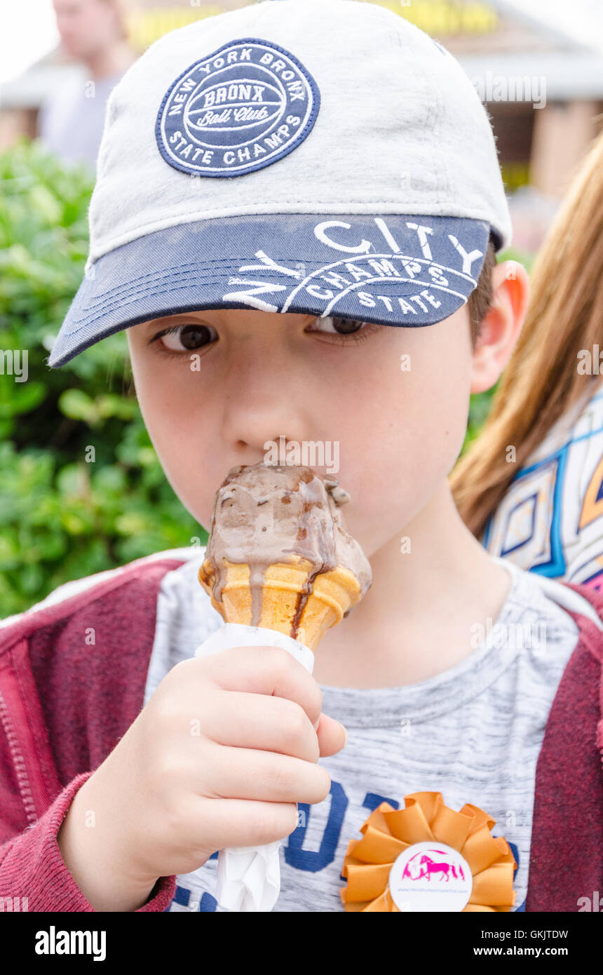 A young boy enjoys a chocolate ice cream Stock Photo - Alamy