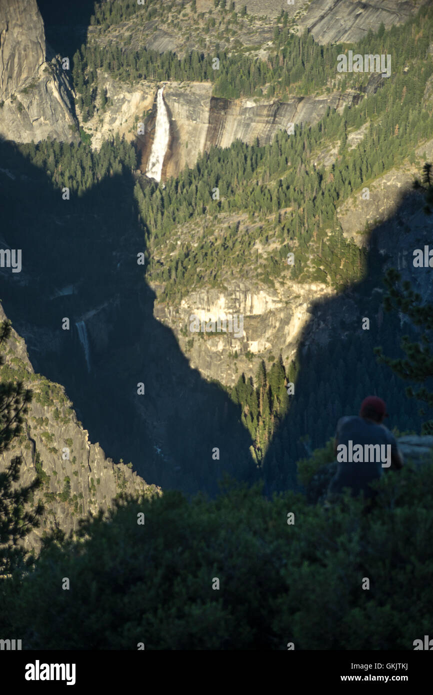 Photographer Taking Photo Of Waterfall in distance Stock Photo - Alamy