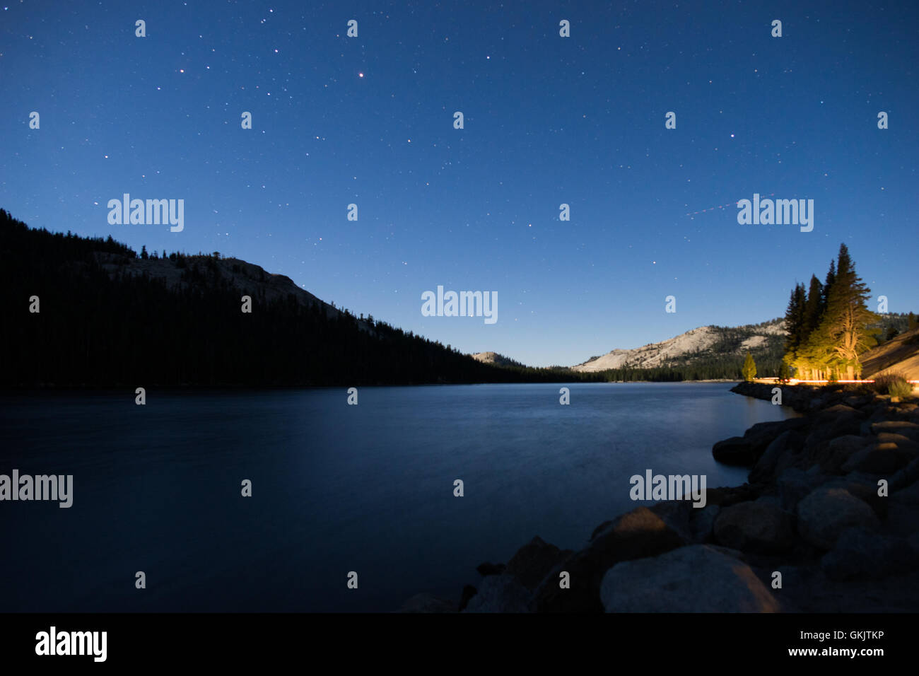 Starry Night over smooth Lake Tenaya Stock Photo - Alamy