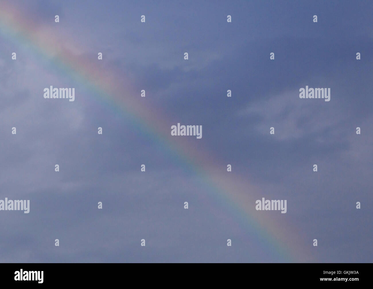 Blue sky with clouds and rainbow hi-res stock photography and images ...