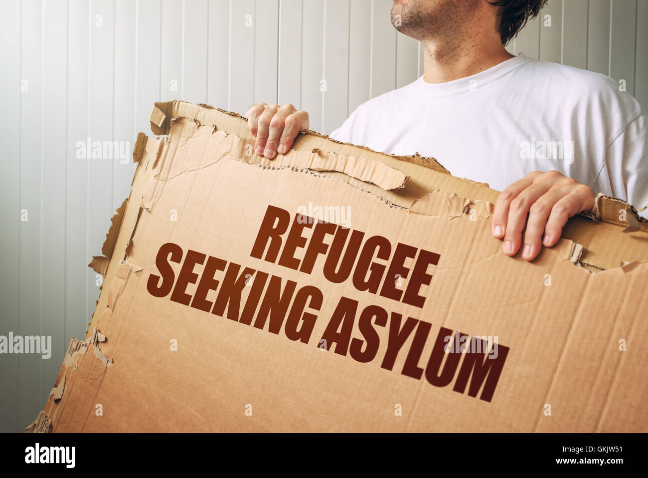 Refugee seeking asylum in foreign country, male immigrant with ...
