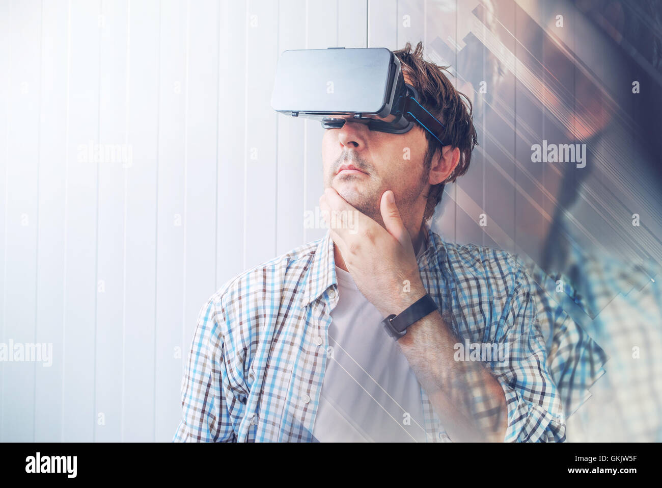 Man with VR goggles exploring virtual reality content and enjoying in ...