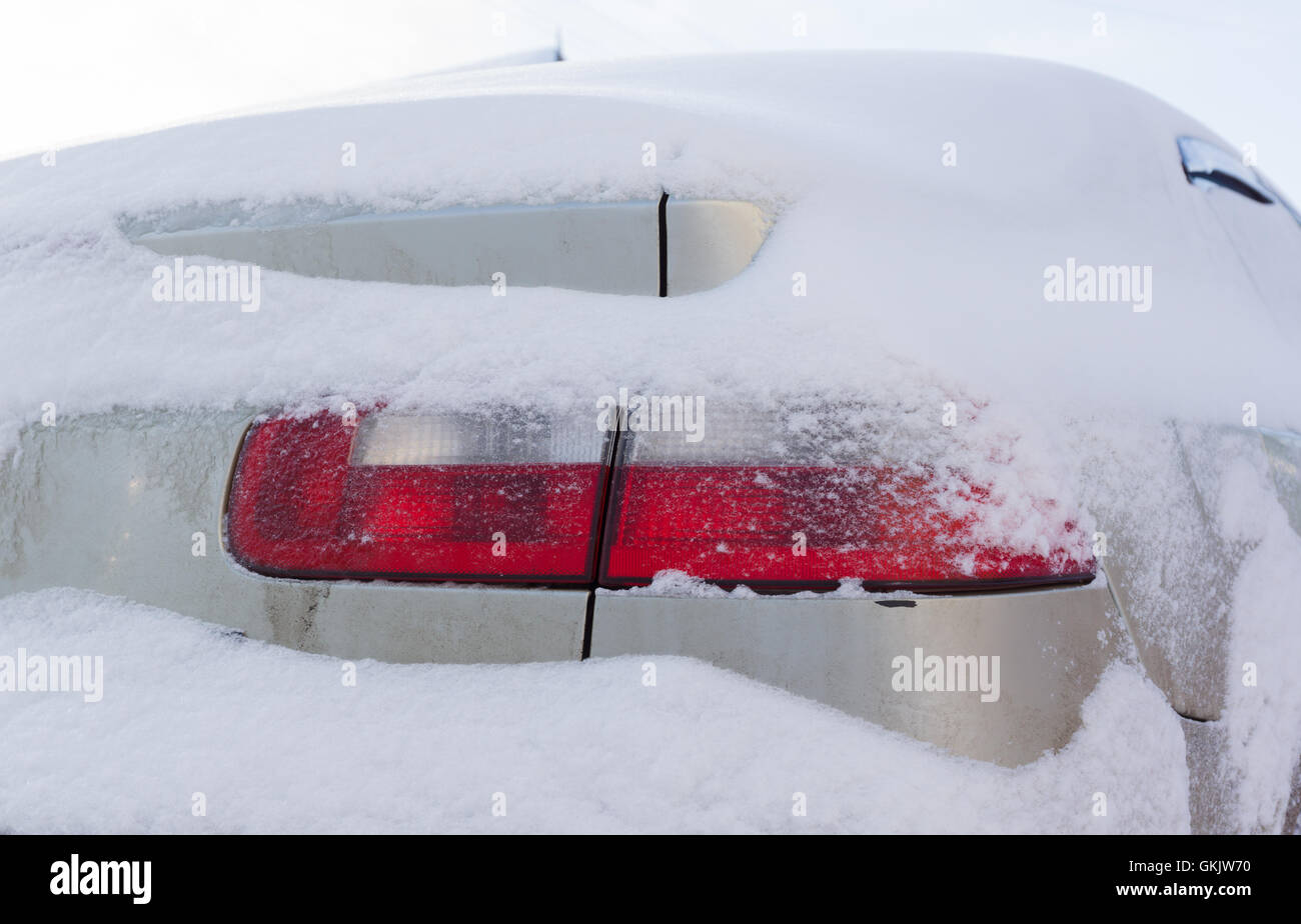 White car covered with snow during a blizzard Stock Photo - Alamy