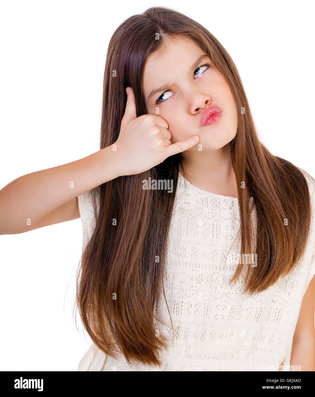 Little Girl making a call me gesture, against white background Stock ...