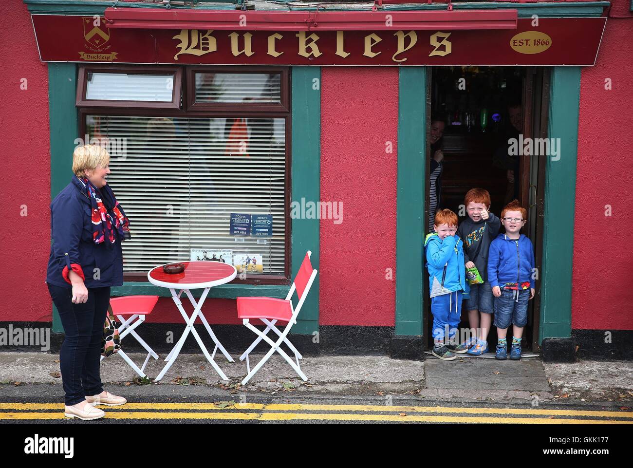 Cousins Aaron Cahill, 3, Jamie, 6, and Adam, 4, from Cork City, wait ...
