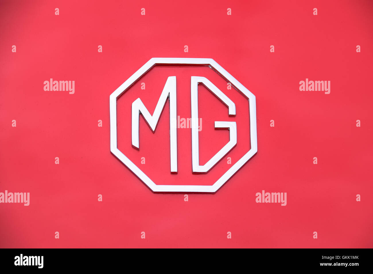 MG car logo against red background Stock Photo - Alamy