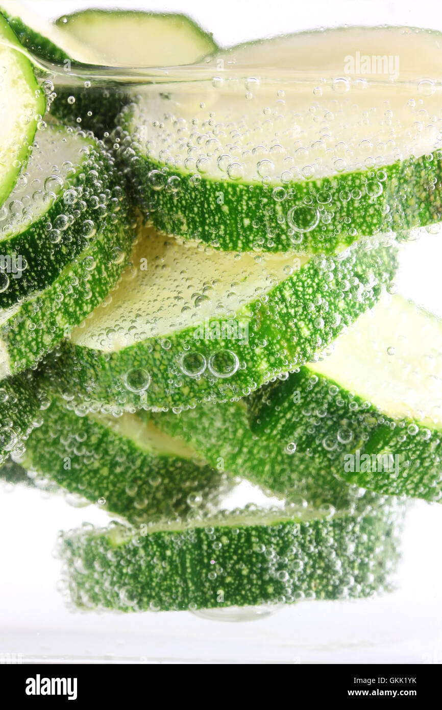 Zucchini sliced in water cooking Stock Photo - Alamy