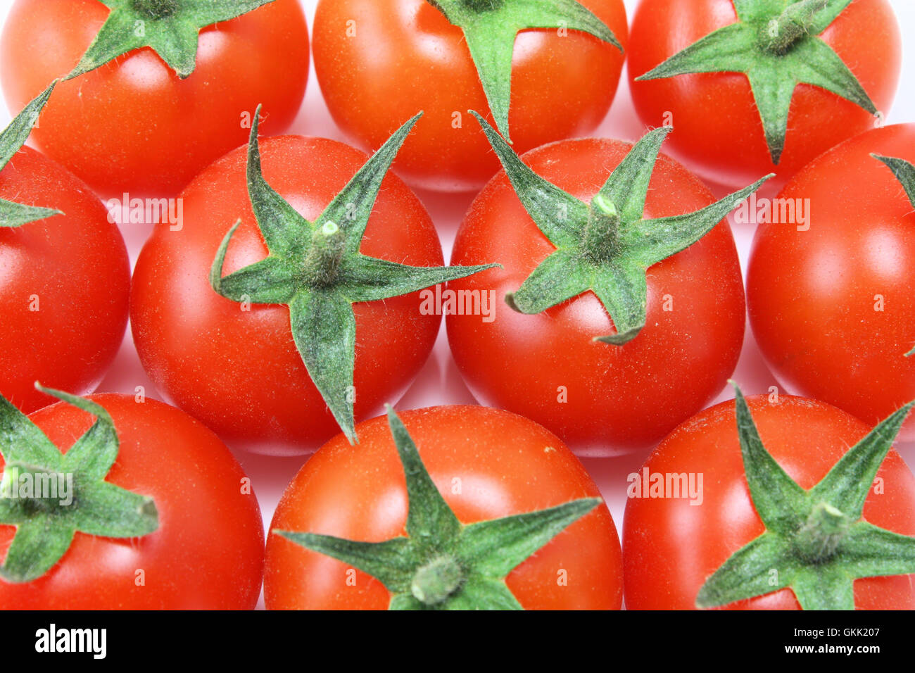 Baby tomatoes in a group Stock Photo - Alamy